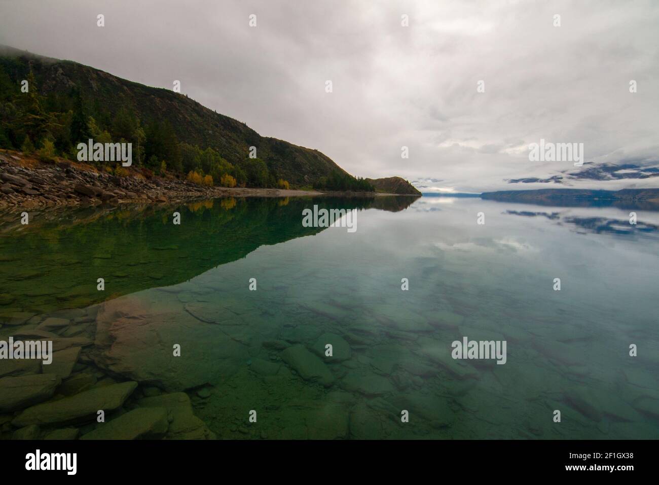 Lake Hawea, South Island of New Zealand. Pristine see- trough blue ...