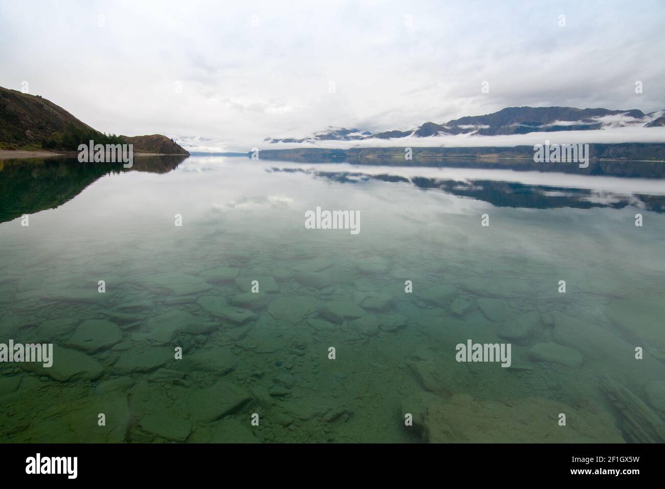 Lake Hawea, South Island of New Zealand. Crystal clear blue water ...