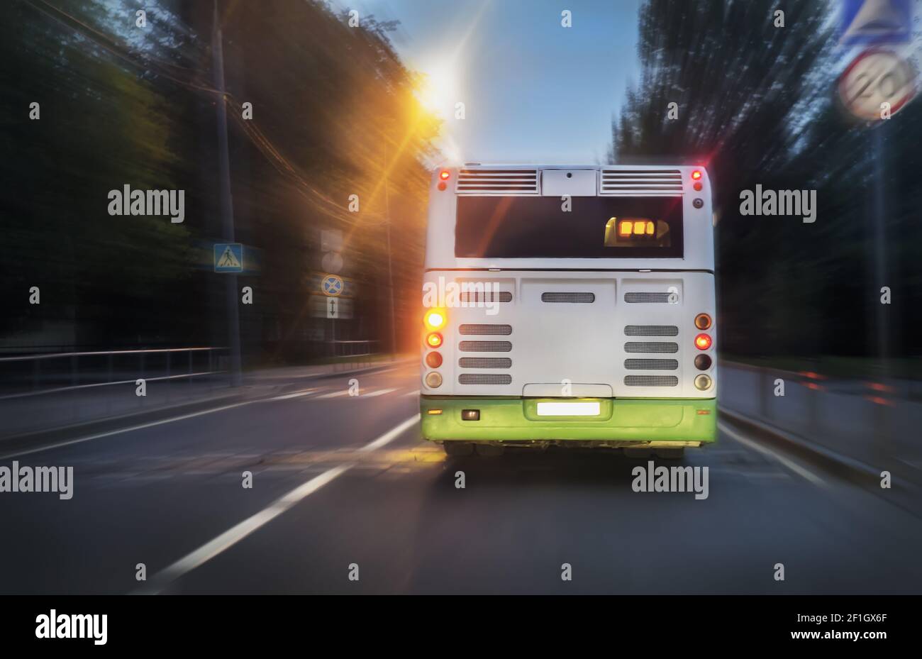 bus moves on city street at night Stock Photo - Alamy