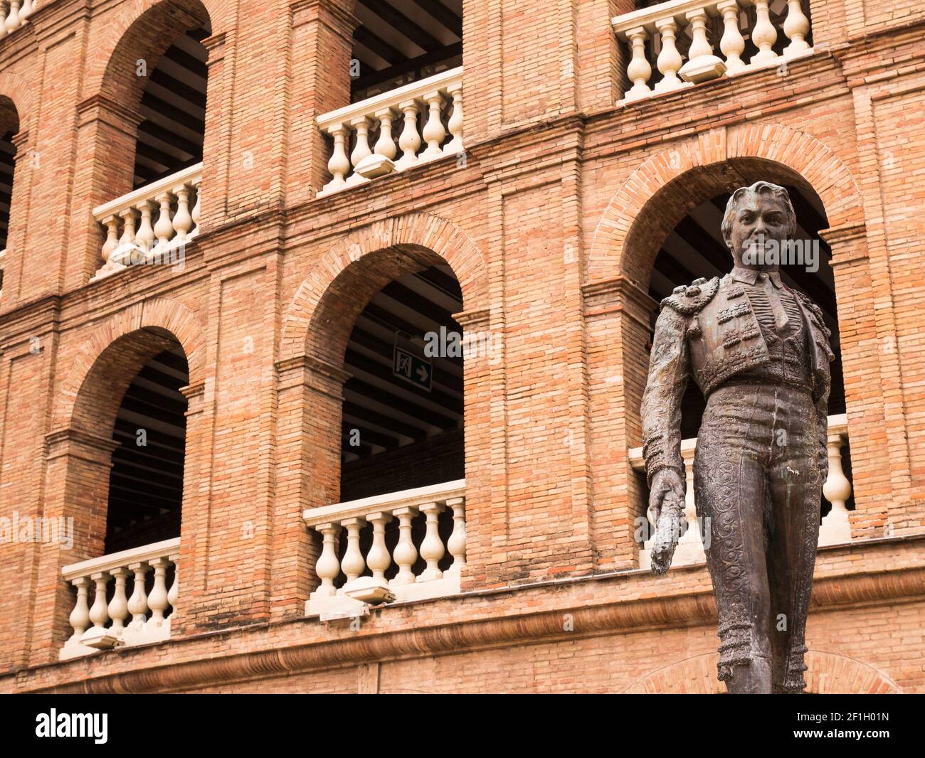 Statue of a bullfighter in front of the bullfight arena in Valencia ...
