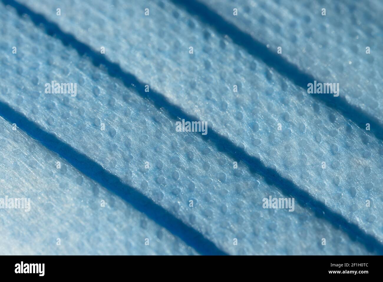 Frame filling abstract background texture of single use folded blue ...