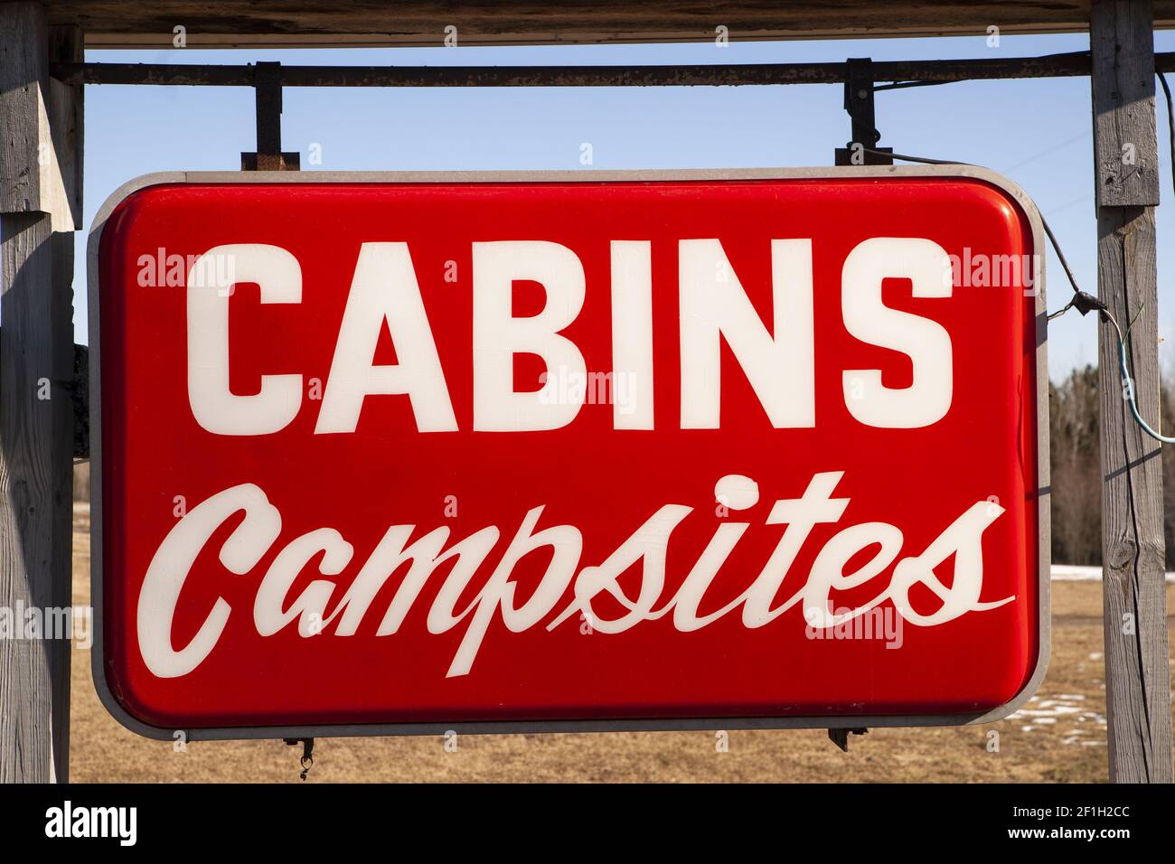 A Red Hanging Roadside Sign Says Cabins and Campsites Stock Photo - Alamy
