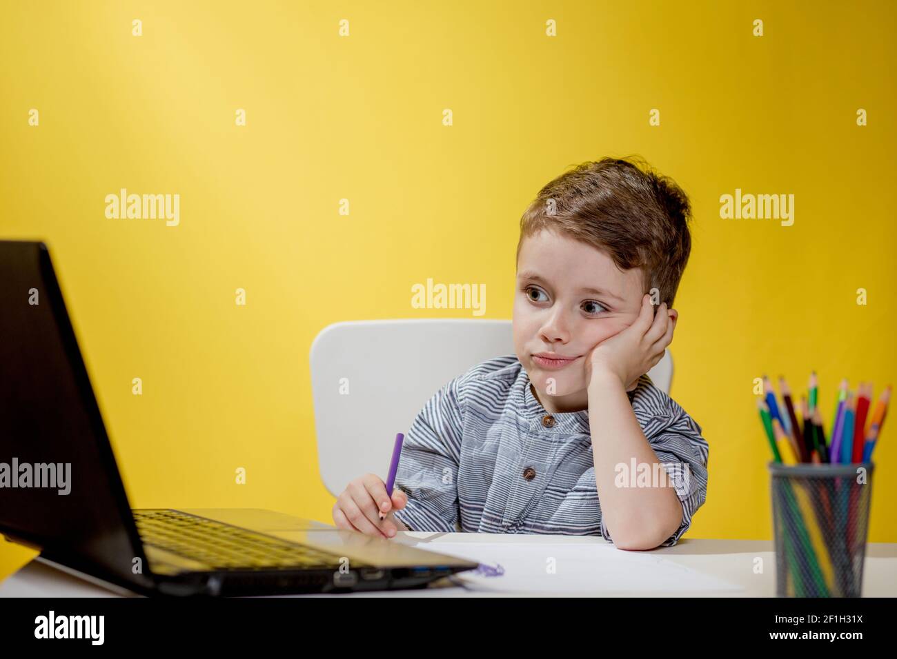 Happy kid having fun watching cartoon on laptop, Child using digital ...