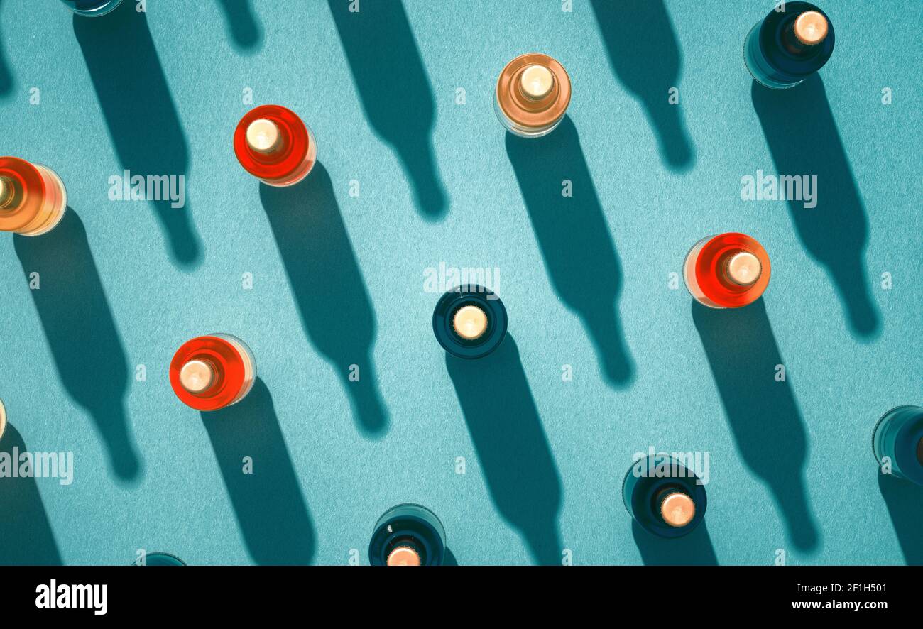 Top view of several glass bottles with metal caps standing on turquoise ...