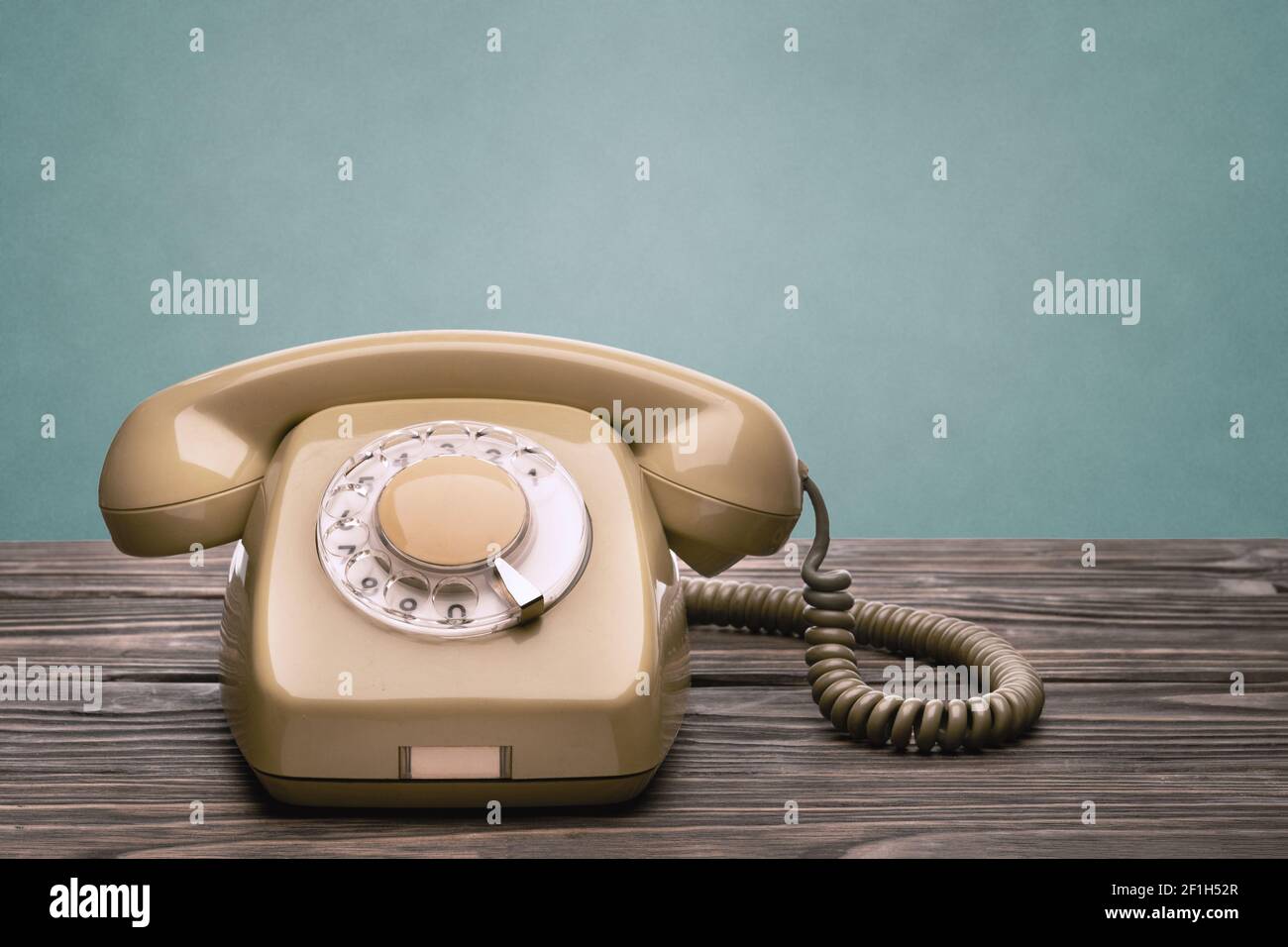 Old telephone set of the 70s of the 20th century stands on the wooden ...