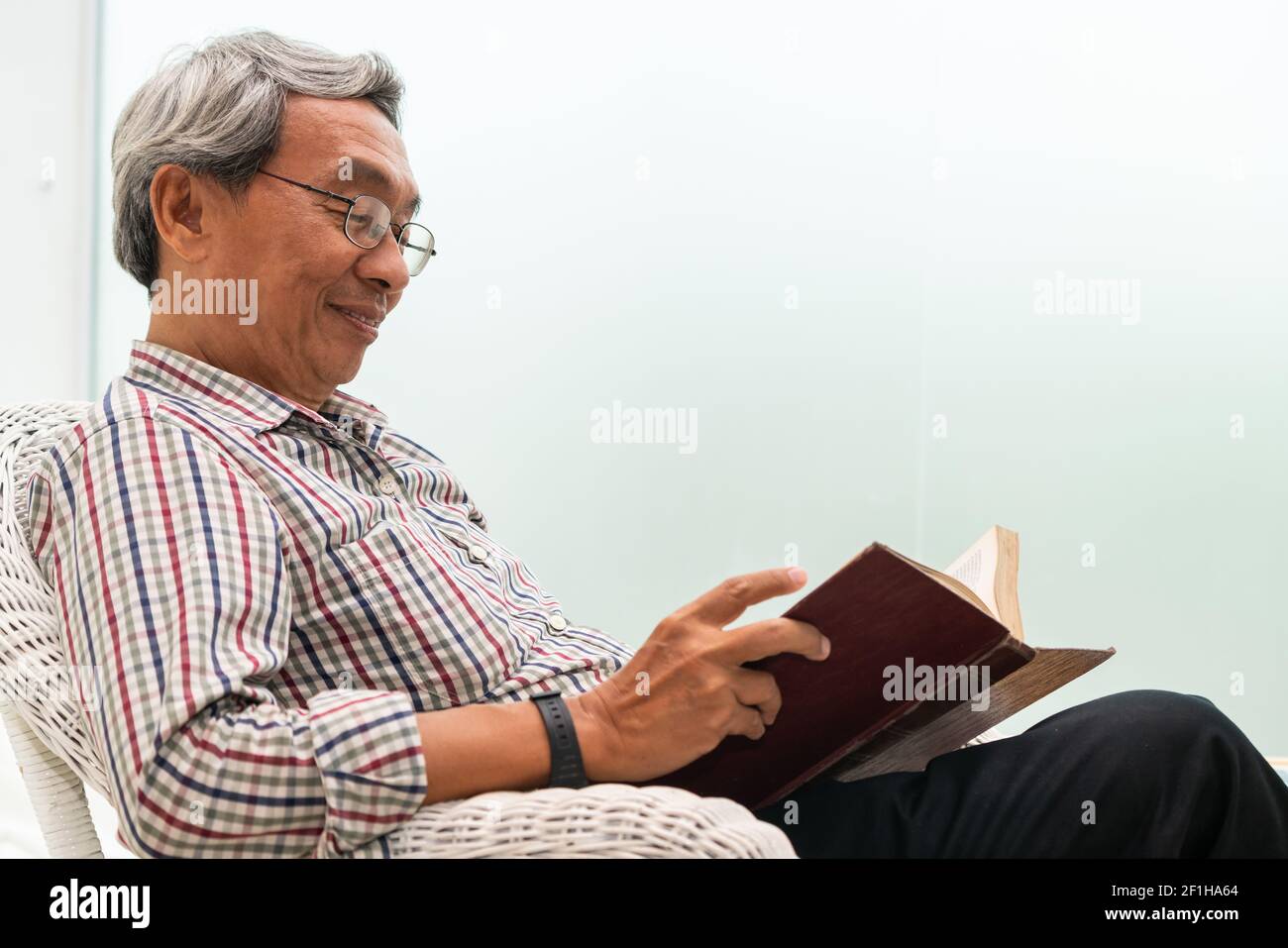 Happy old man in armchair hi-res stock photography and images - Alamy