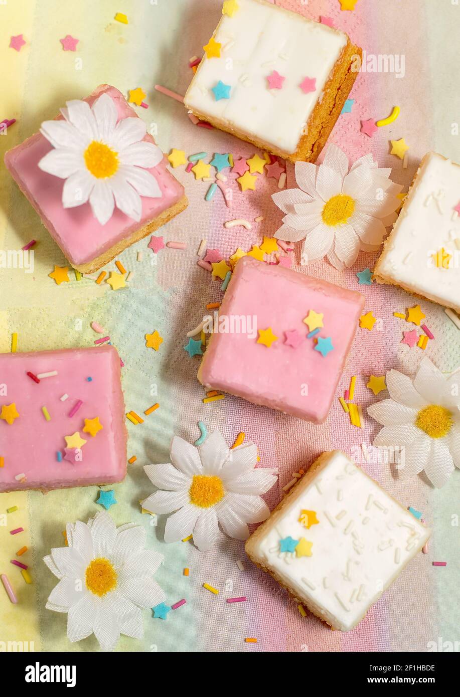 Pink and white iced cakes Stock Photo - Alamy