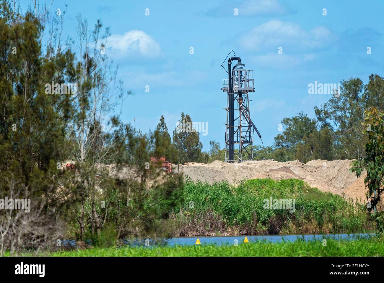 Sand pump tower stockpiling sand pumped from a river Stock Photo - Alamy