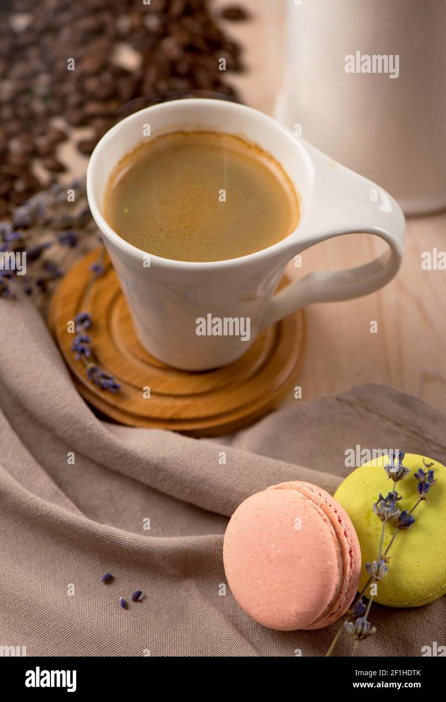 cup of coffee and coffee beans in a sack on dark background Stock Photo ...