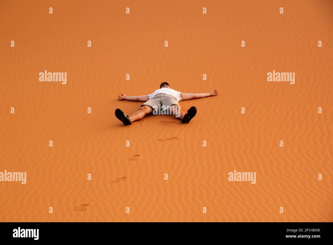 Tourist on a sand dunes Stock Photo - Alamy