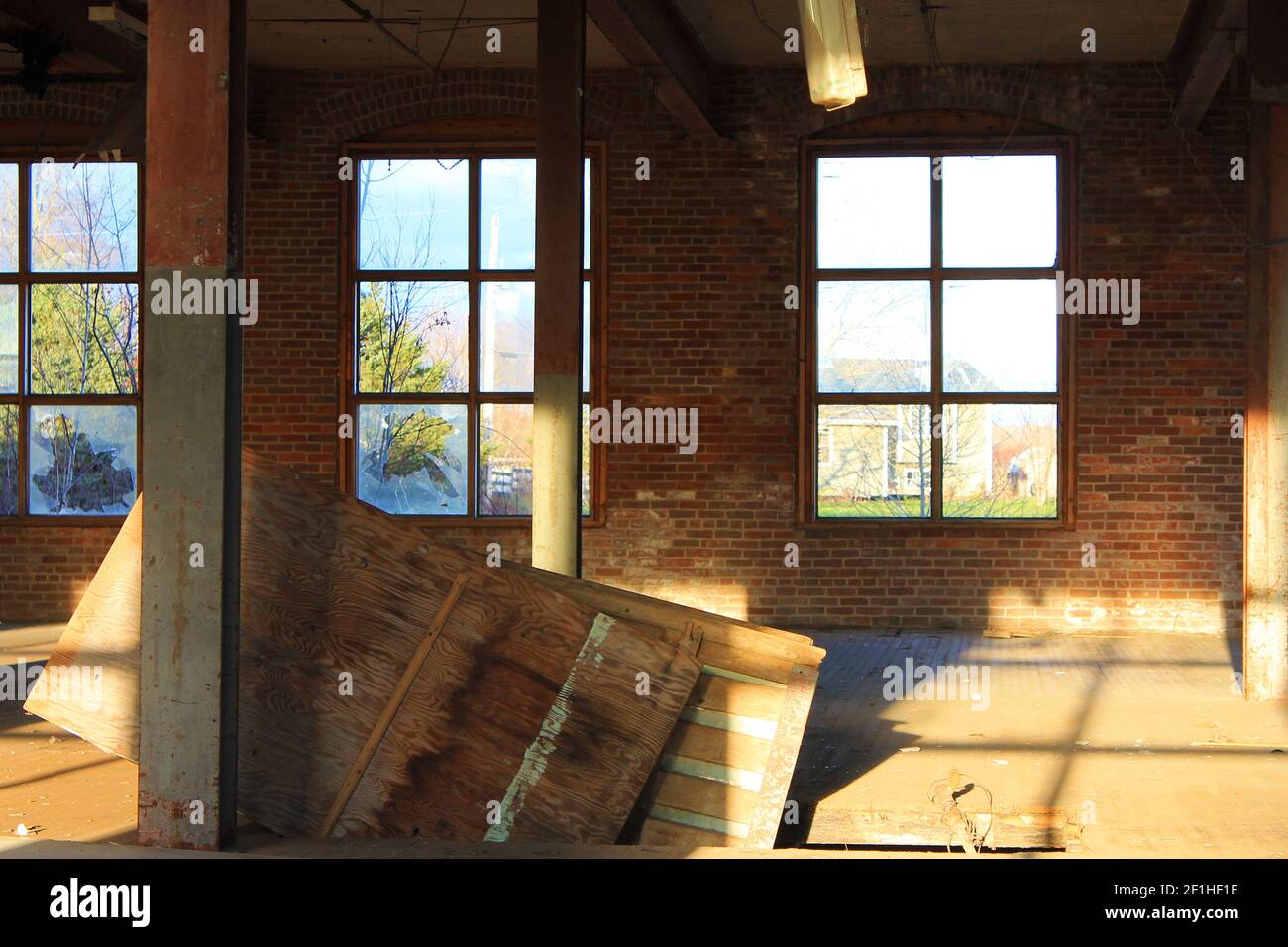 Interior view of an old, run-down, and abandoned factory building. Big ...