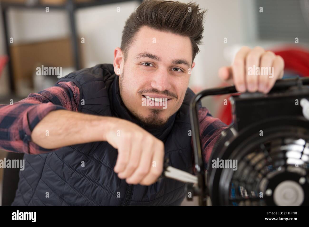 man repairing an electrical fan Stock Photo - Alamy