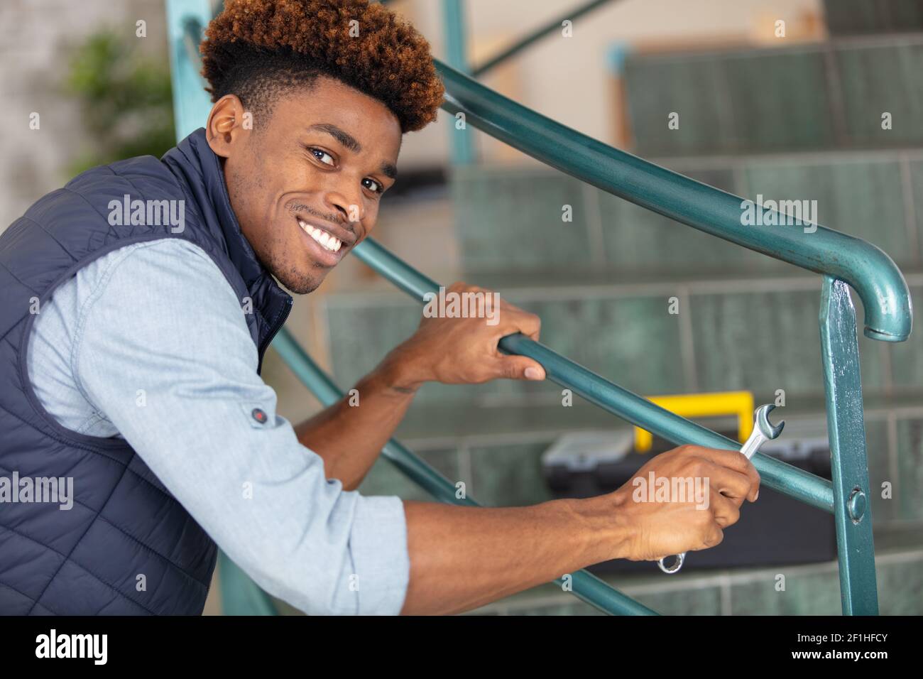Man using stairs install hi-res stock photography and images - Alamy