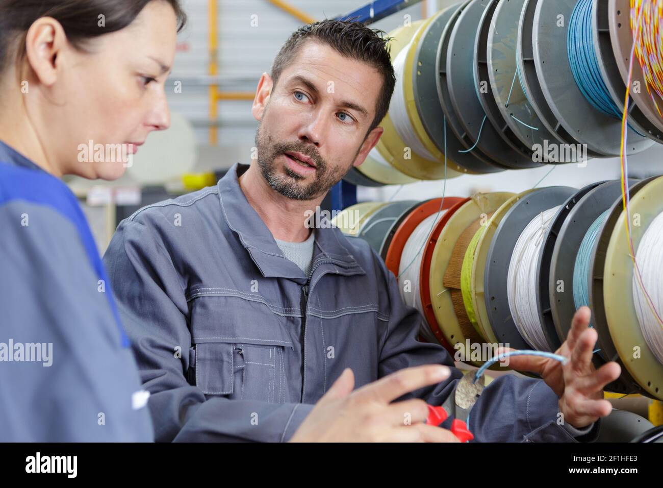 two engineers are working with wires Stock Photo - Alamy