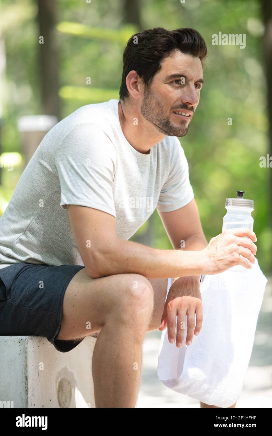 runner man resting after exercise Stock Photo - Alamy