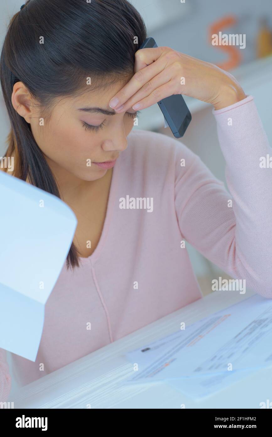 sad woman reading a letter Stock Photo - Alamy