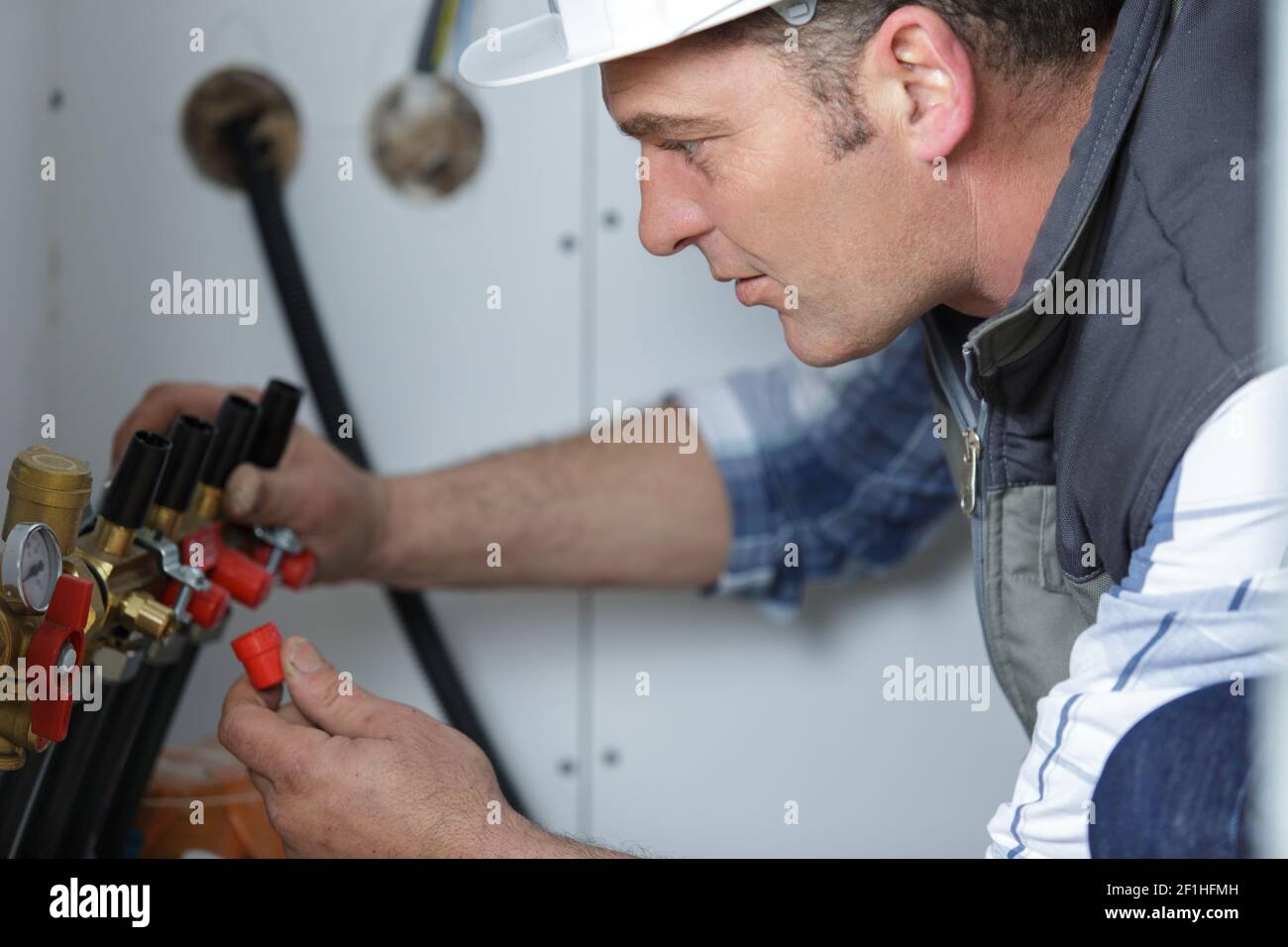 a professional plumber fixing pipes Stock Photo - Alamy