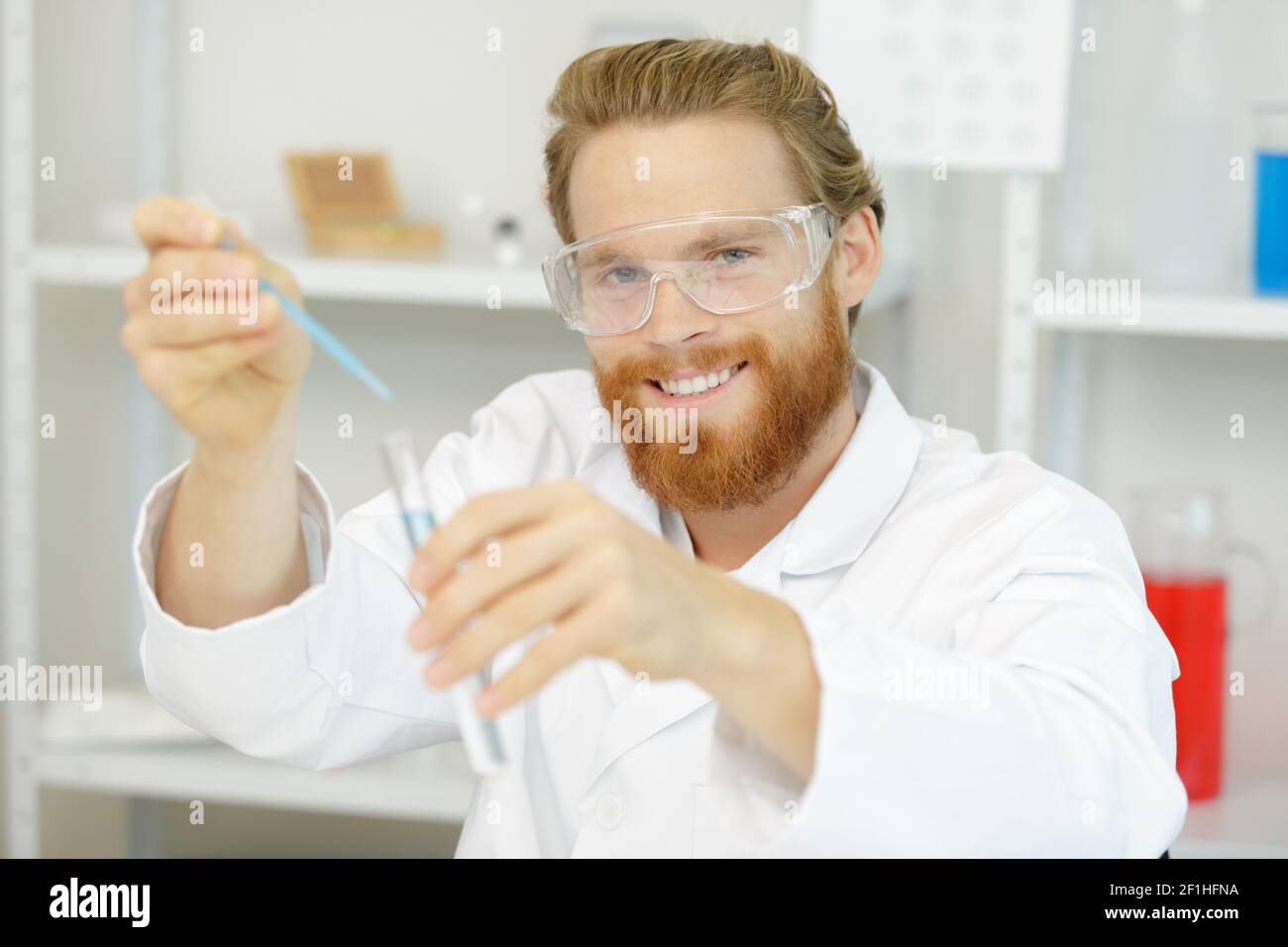 man in the laboratory while performing experiments Stock Photo - Alamy