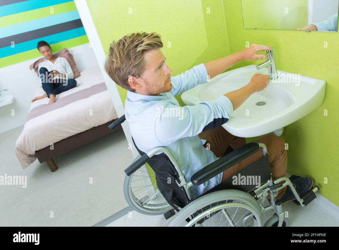 Man handicap disability washing hi-res stock photography and images - Alamy