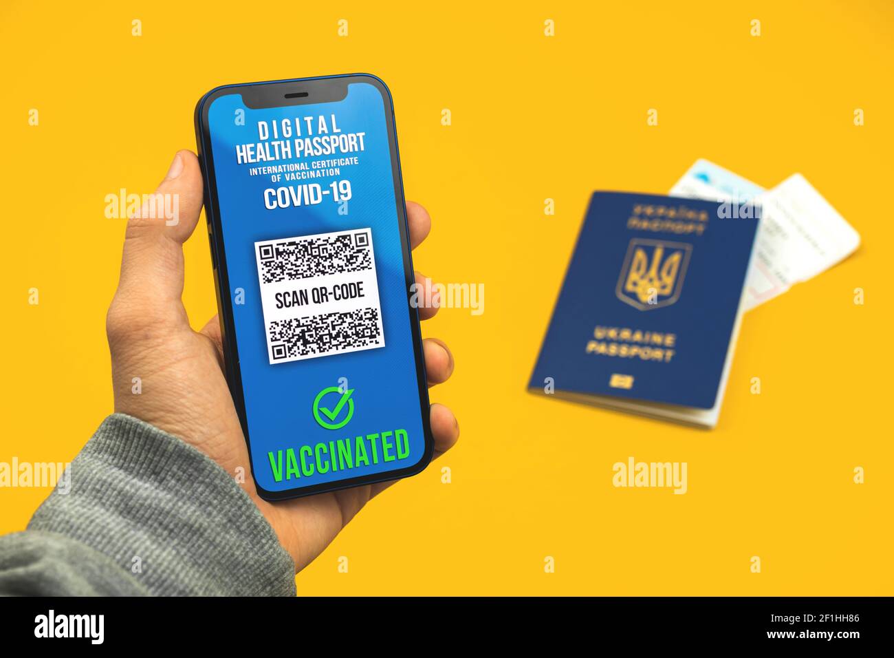 Person shows valid health passport app on mobile phone screen ...