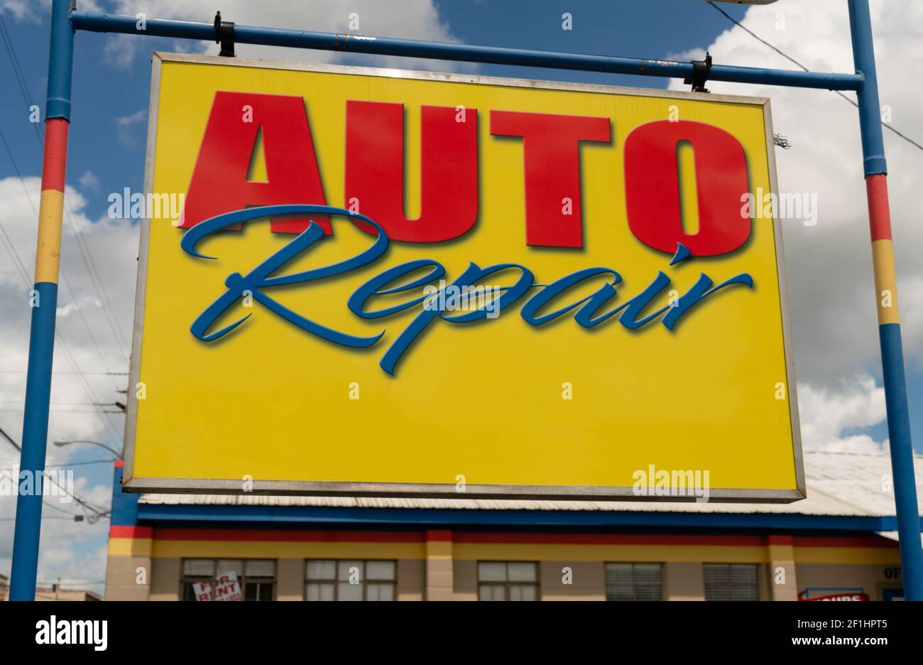 Bright Yellow and Blue Sign Advertising an Auto Repair Shop Stock Photo ...