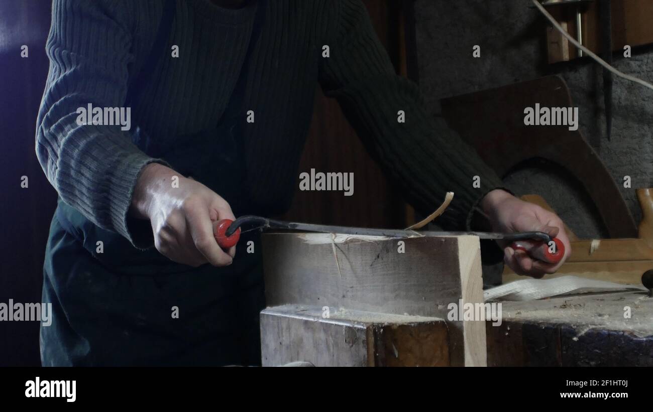 Planer carpenter with two-handle planer Stock Photo - Alamy