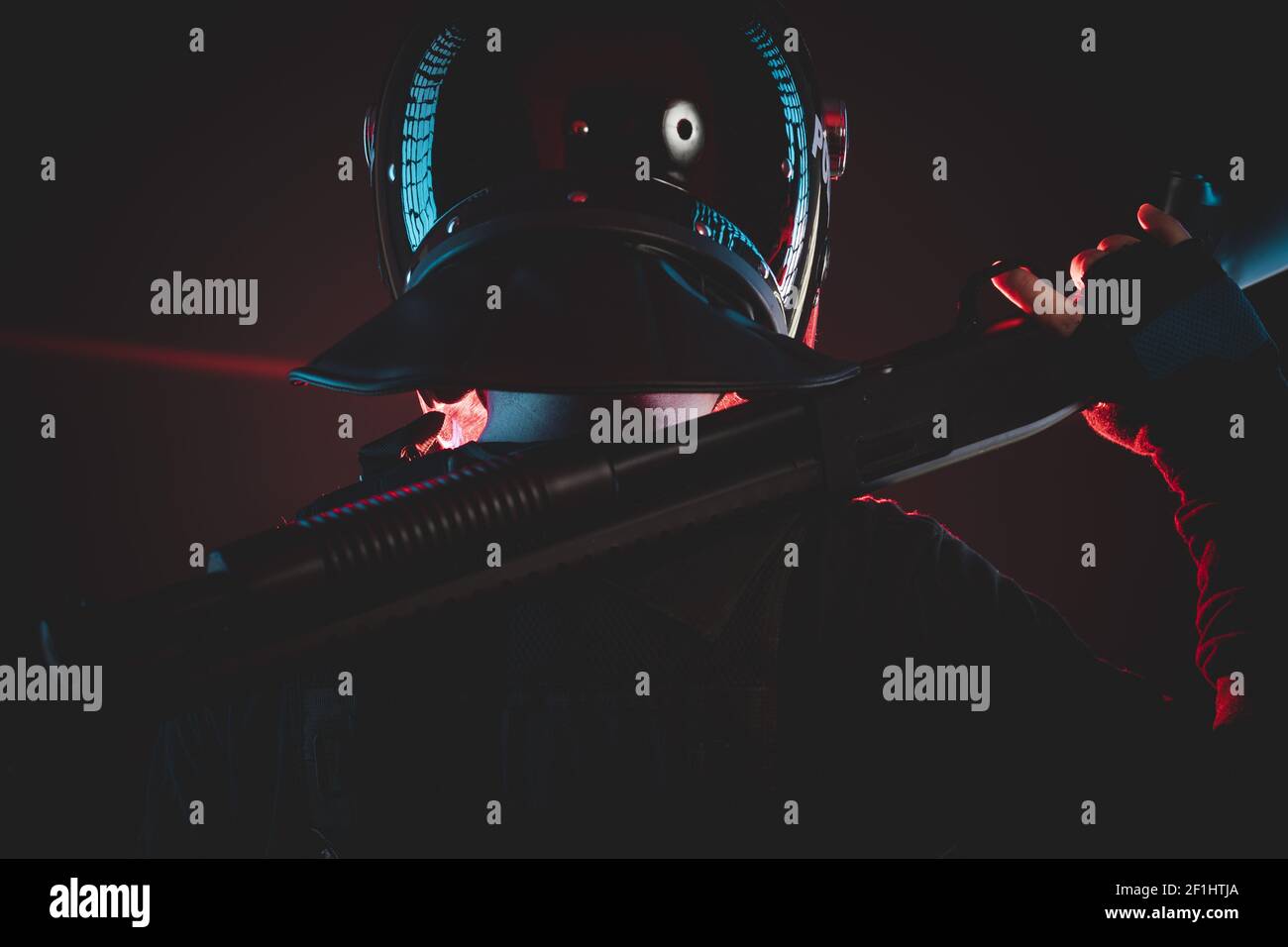 Riot police with red hazard lights. armed man with helmet and ...