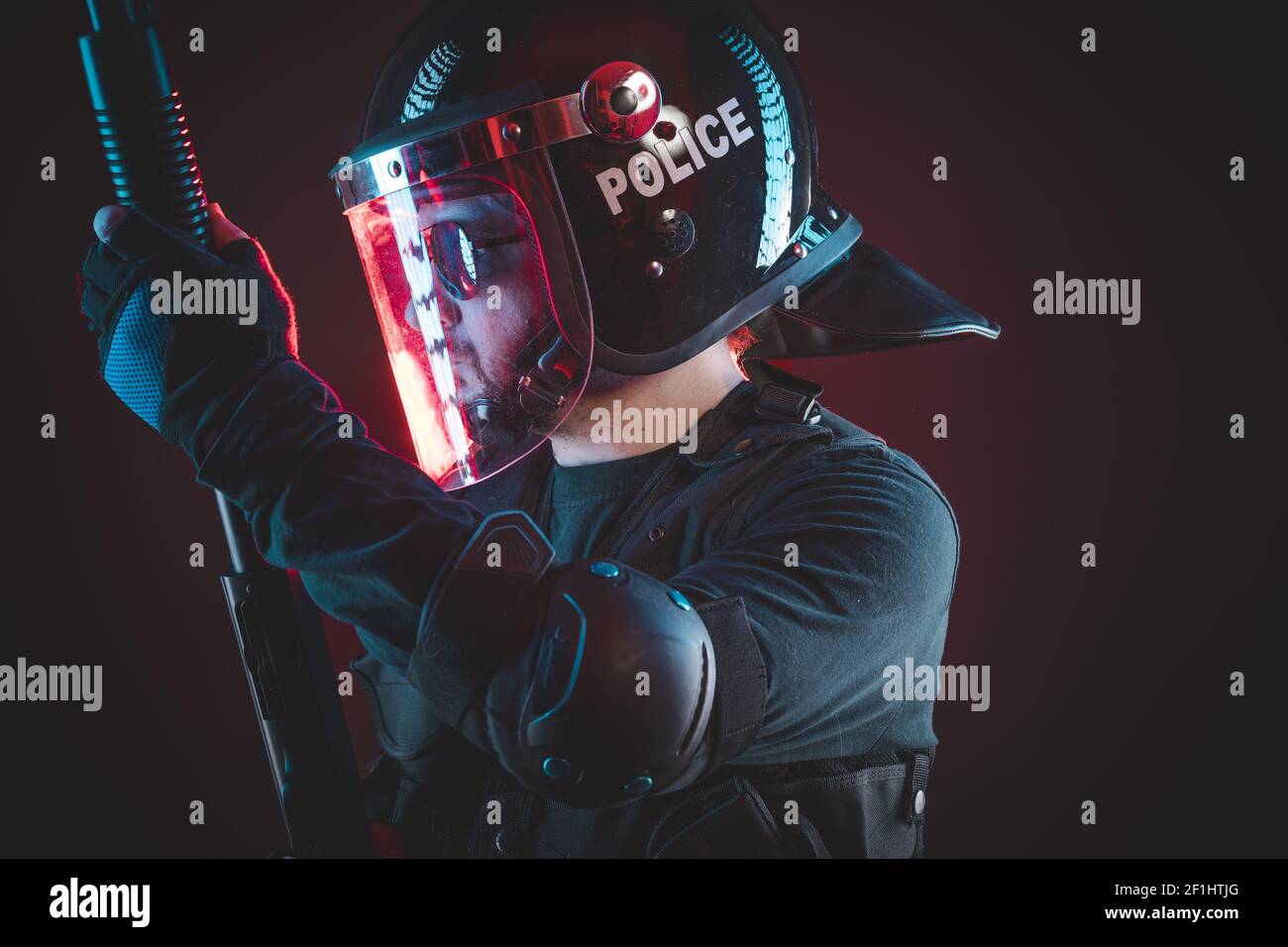 Soldier, riot police with red hazard lights. armed man with helmet and ...