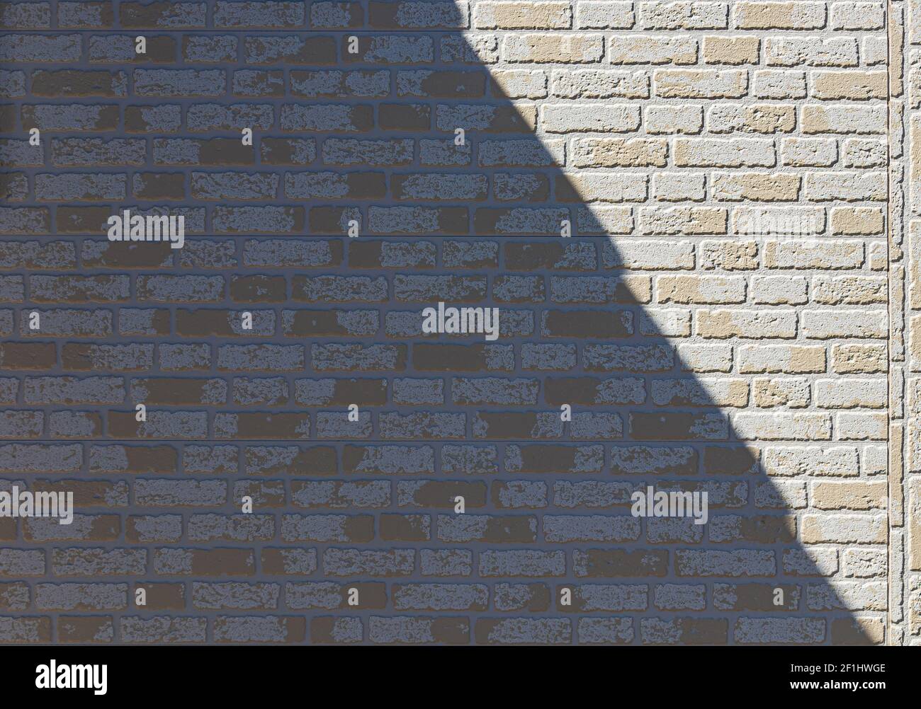 Fake bricks and the shadow of a roof falling onto it, might be what you ...
