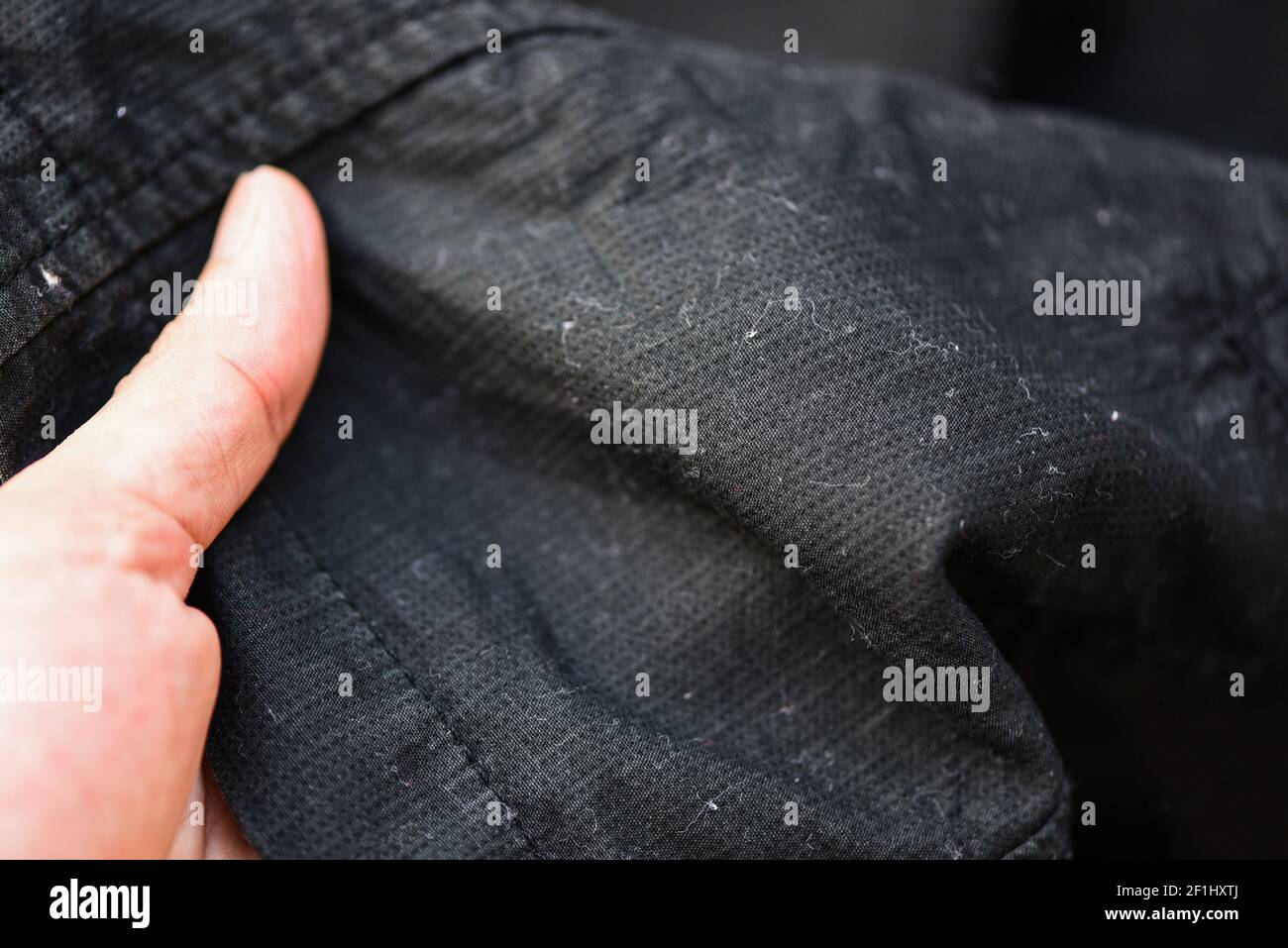 wool on clothes removing spools from a fabric concept, Problem of poor ...