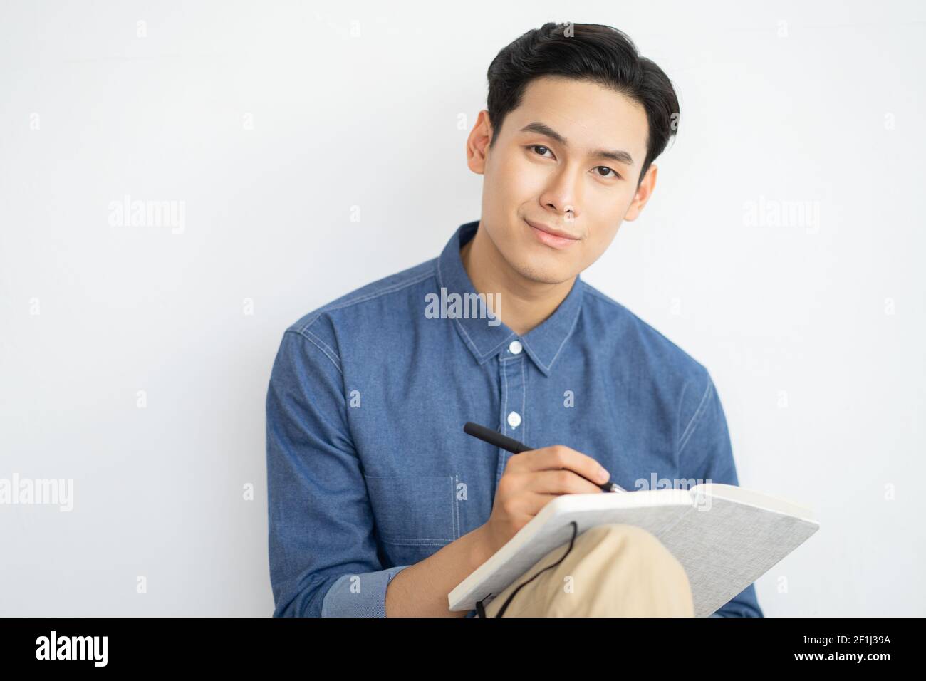 Young writer writing novel hi-res stock photography and images - Alamy
