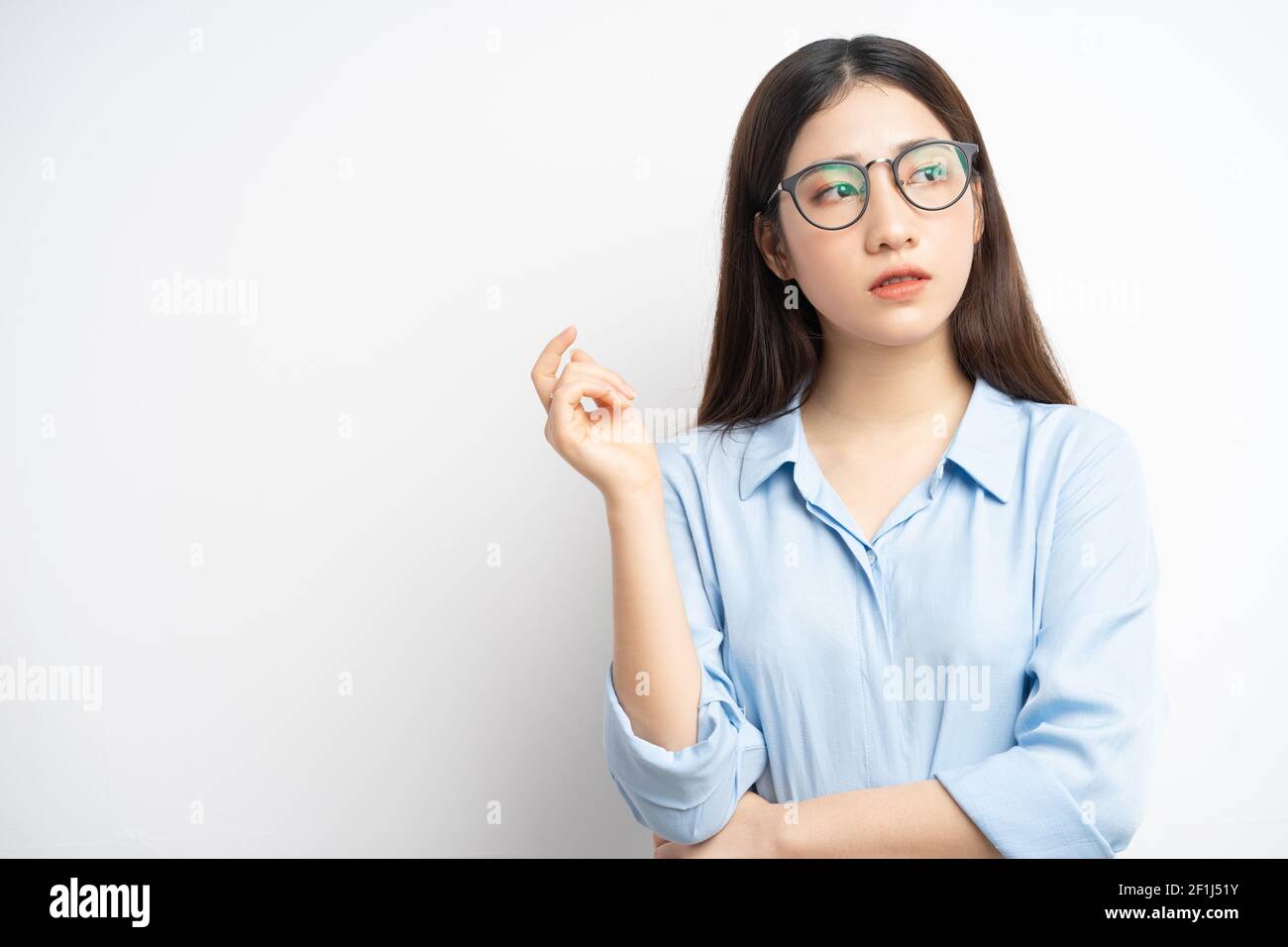 Portrait of Asian woman thinking Stock Photo - Alamy