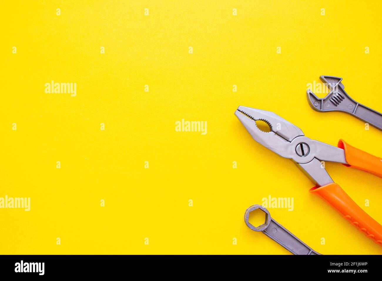 Set of children's plastic tools on an isolated background. Building ...