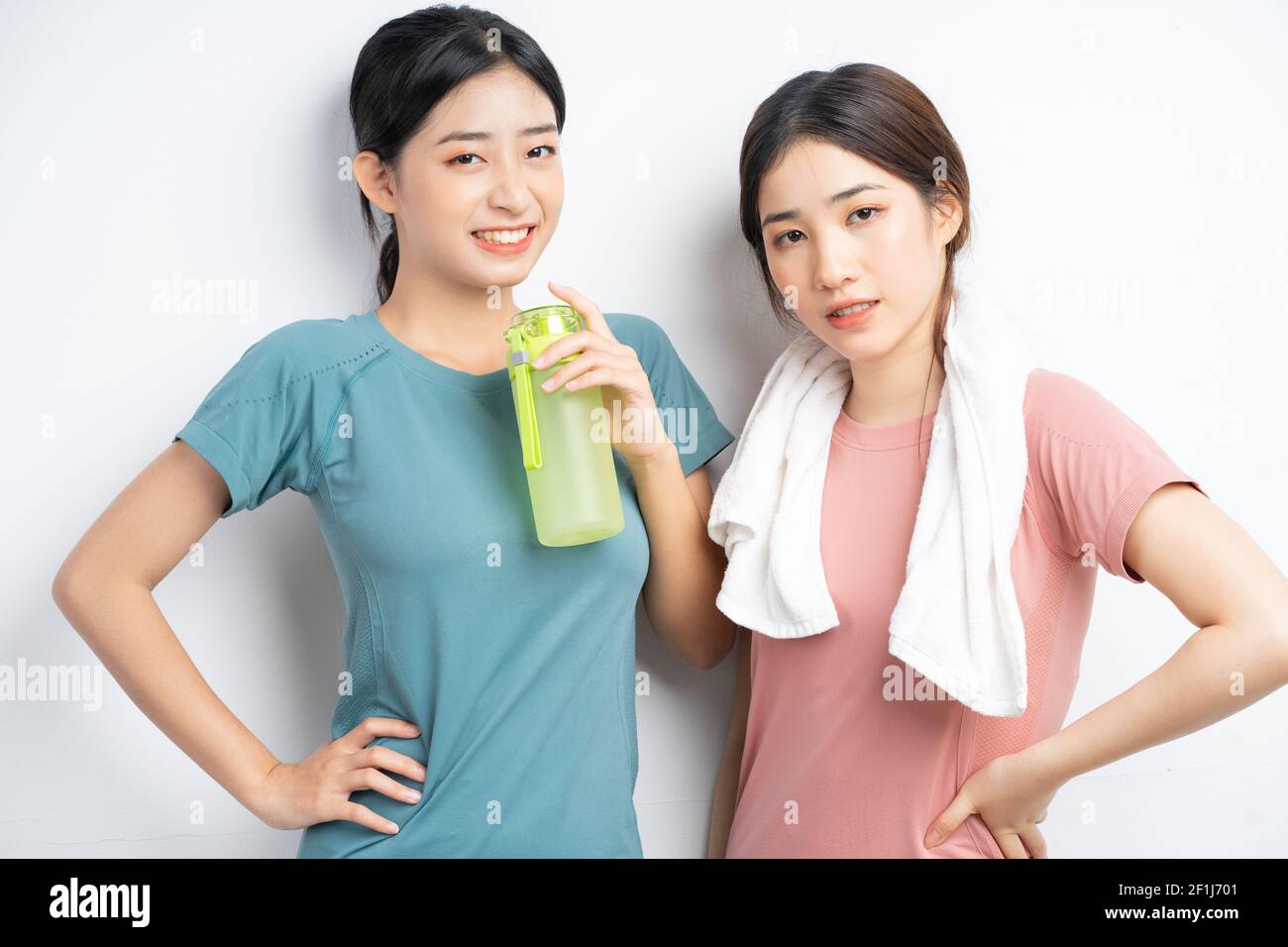portrait of two asian women wearing gym clothes Stock Photo - Alamy