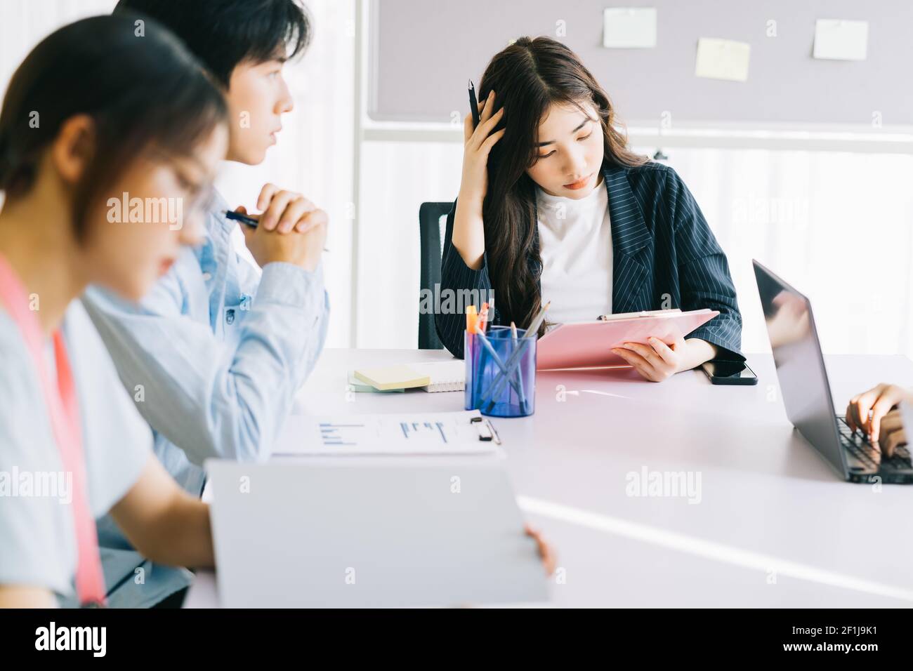 The business team members are discussing next month's plans together ...
