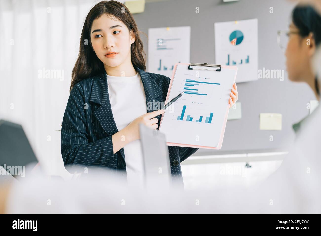 The Asia team leader is giving a presentation to everyone in the ...