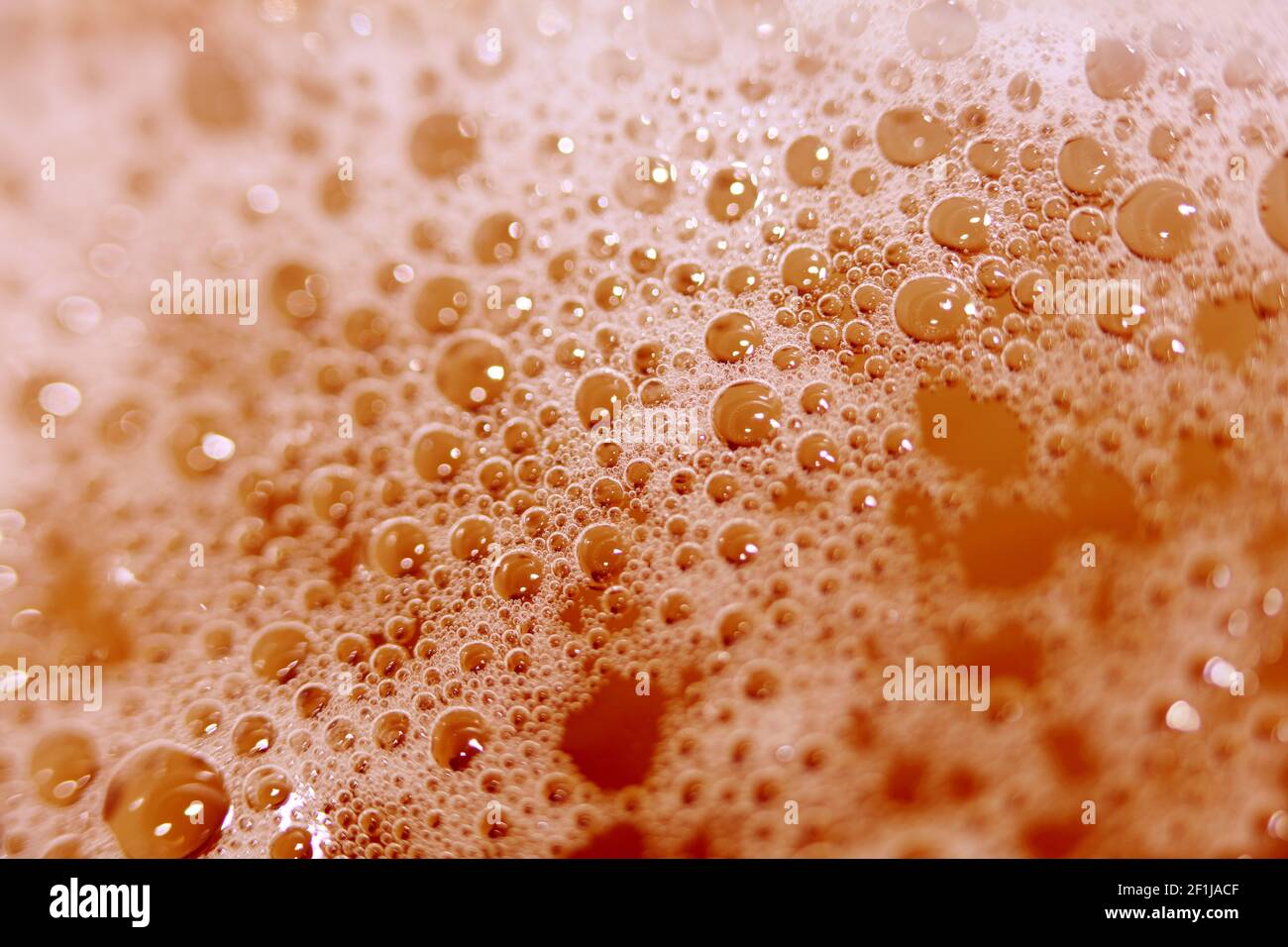 Different size of water bubbles close up modern yellow background high ...