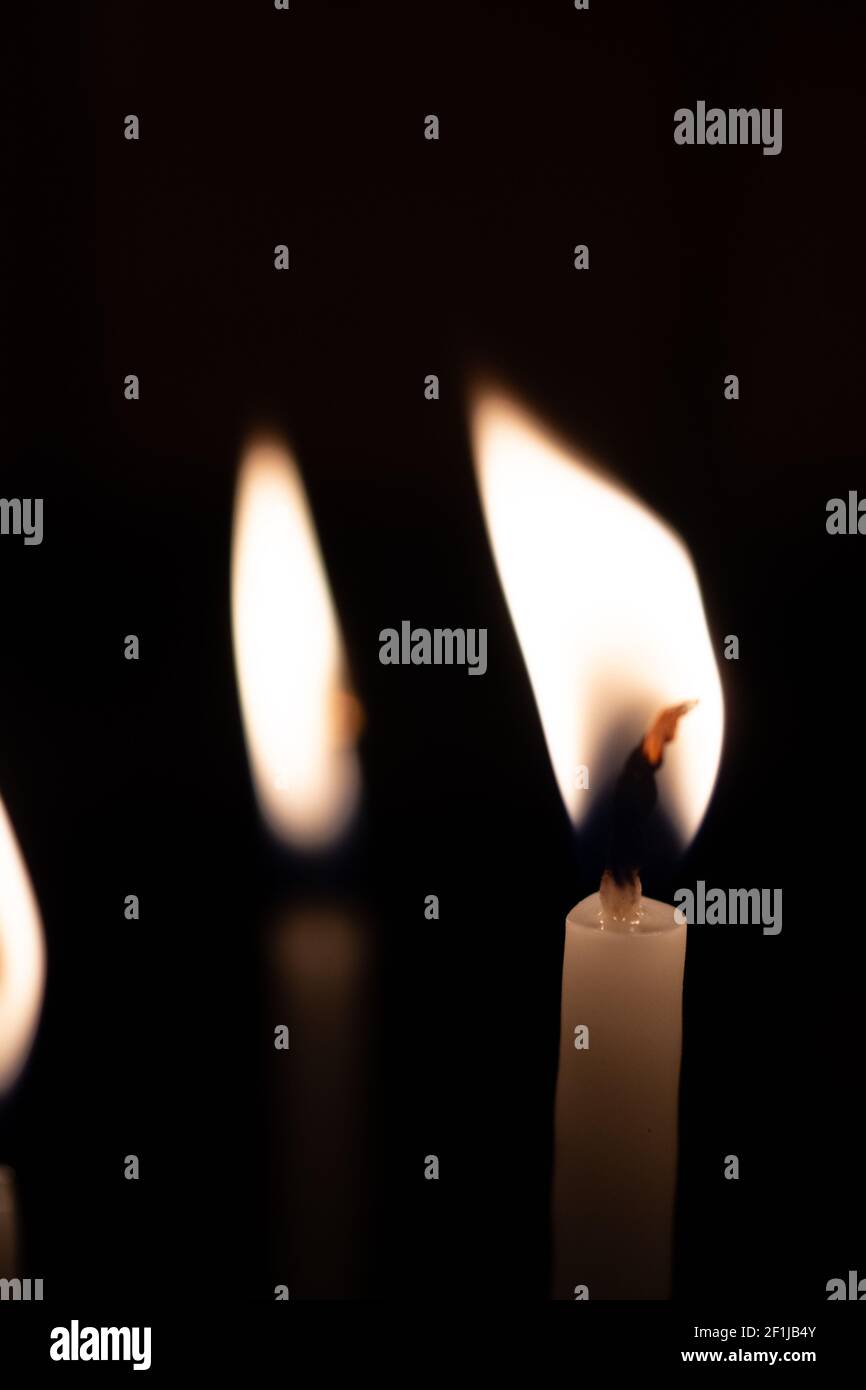 Candle lights in the darkness. Abstract candles background. Hope, fire ...
