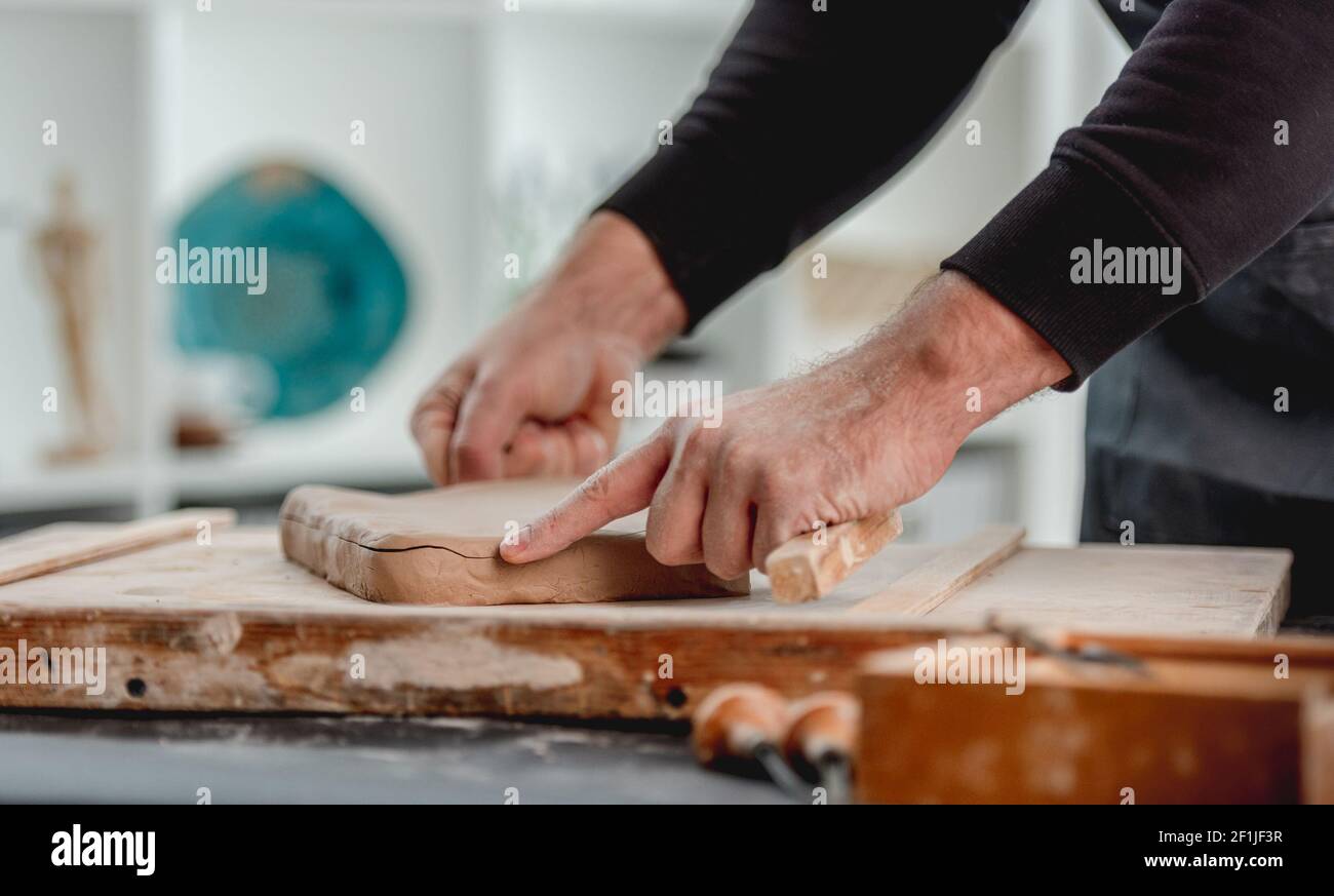 Man molding clay hi-res stock photography and images - Alamy