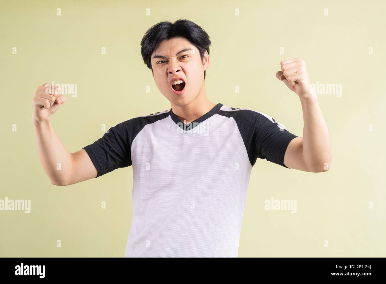 The Asian man was screaming out of a triumphant expression Stock Photo ...
