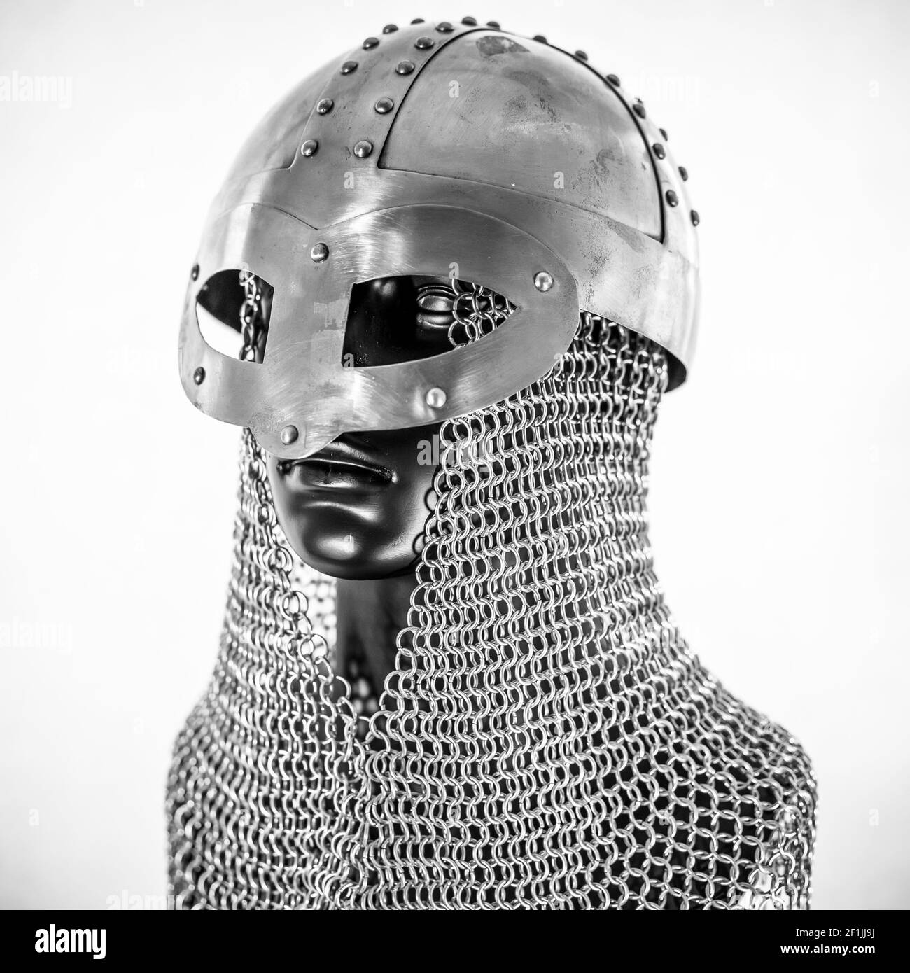 Metal, Viking helmet with chain mail in a black mannequin on white ...