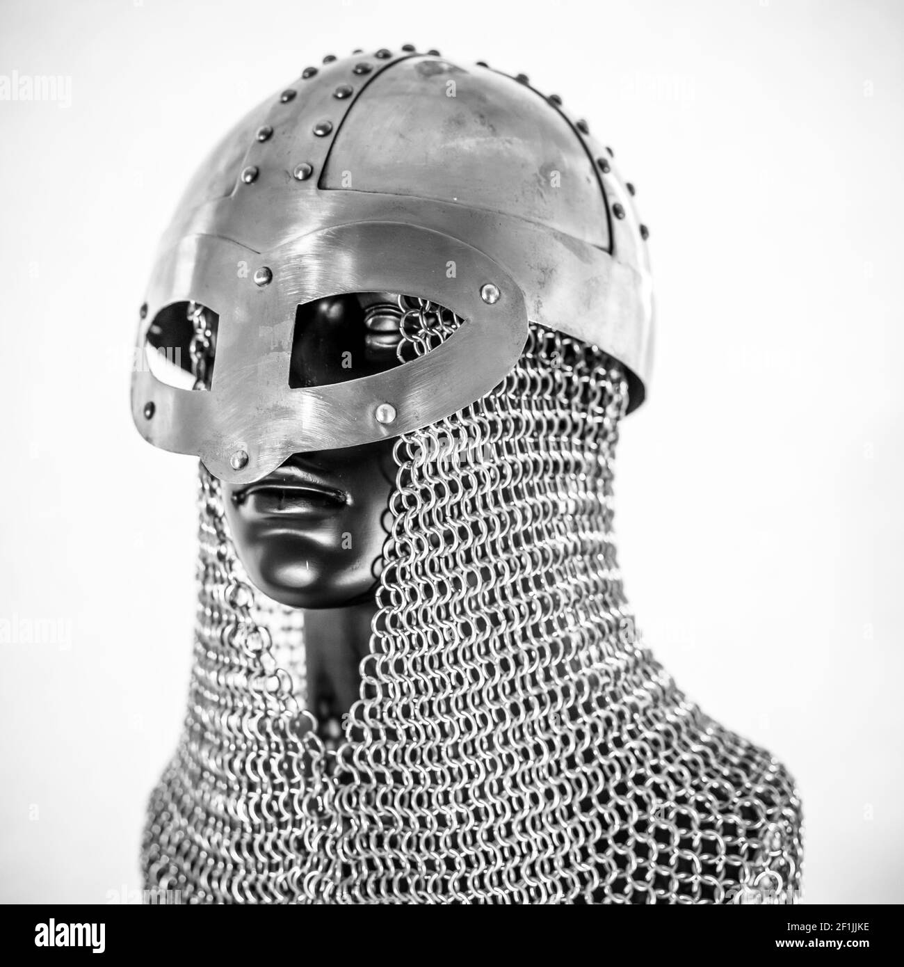 Metal, Viking helmet with chain mail in a black mannequin on white ...