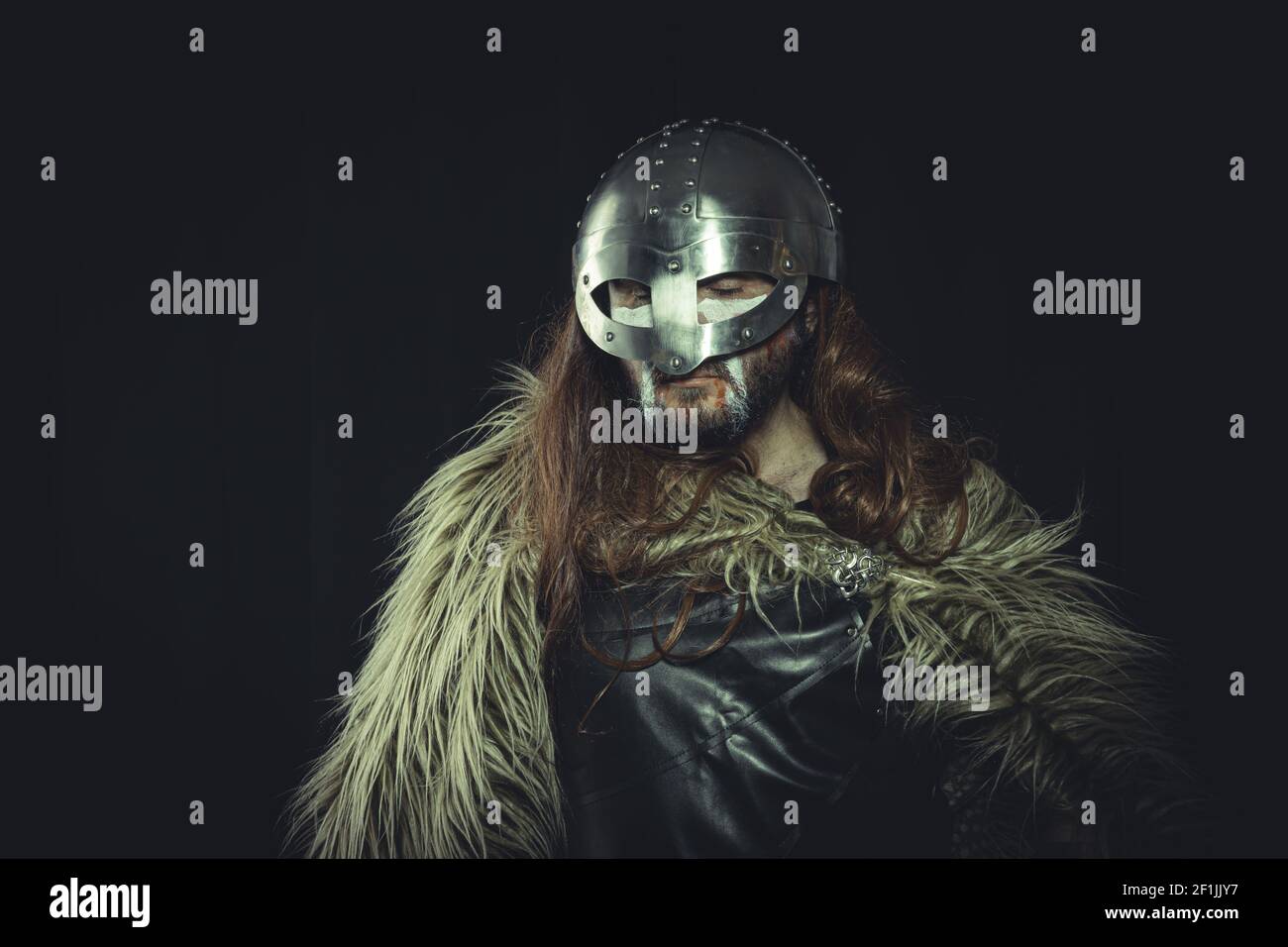Viking, Scandinavian warrior with helmet and war paintings, wears a ...