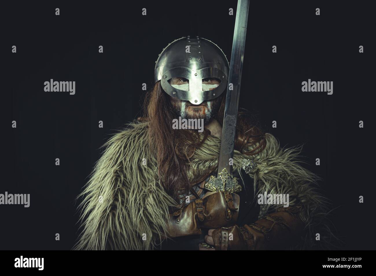Viking, Scandinavian warrior with helmet and war paintings, wears a ...