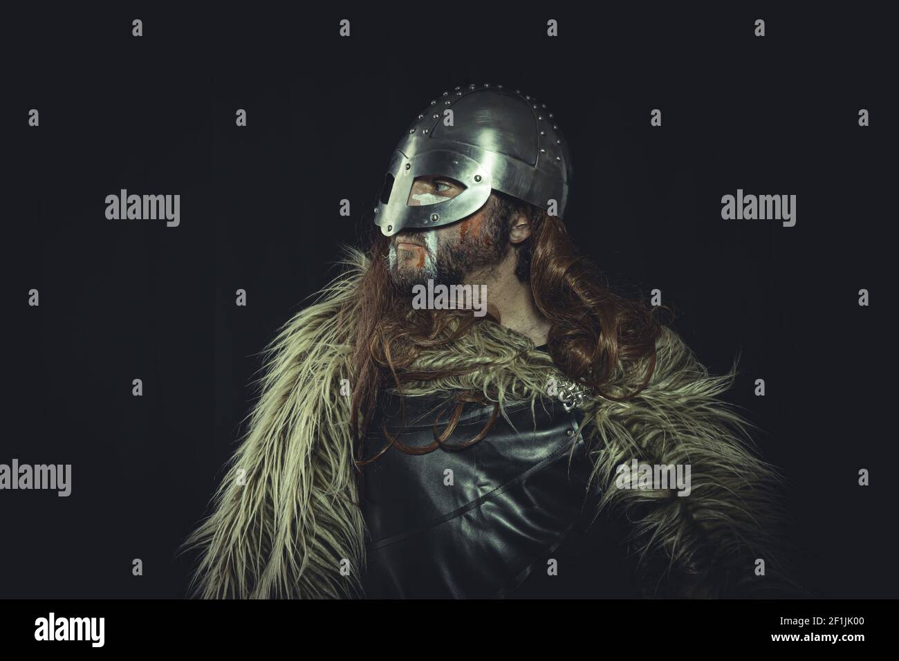 Viking, Scandinavian warrior with helmet and war paintings, wears a ...
