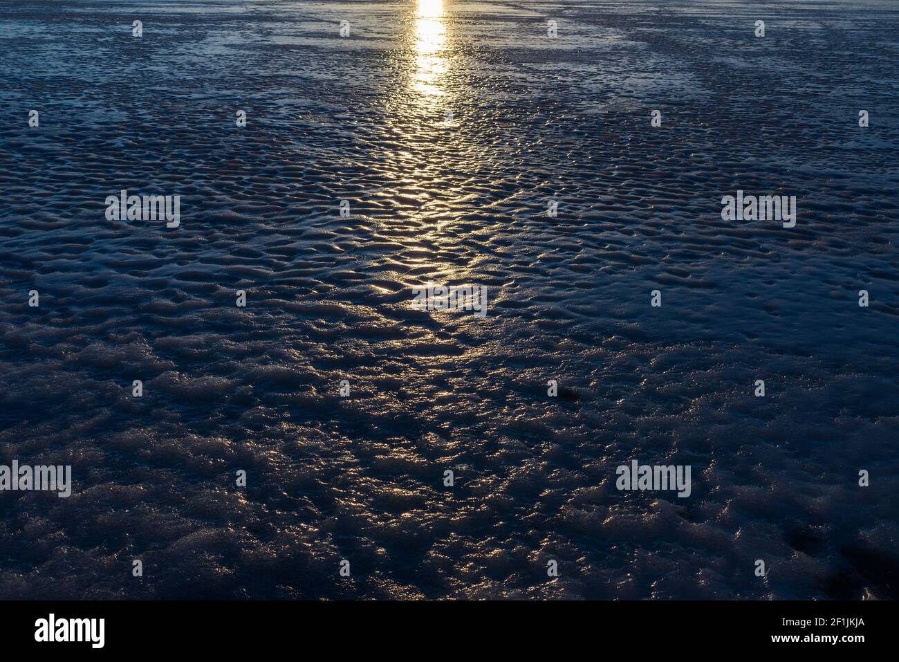 Sun reflection on the ice . Winter Sunset in the Village Stock Photo ...