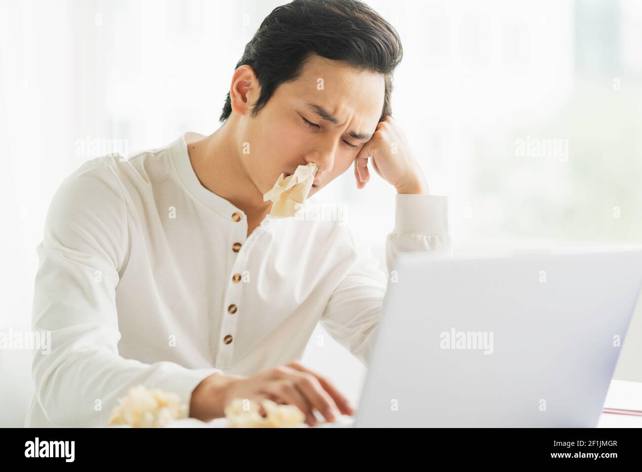 Portrait of a sick male employee still having to go to work with a ...