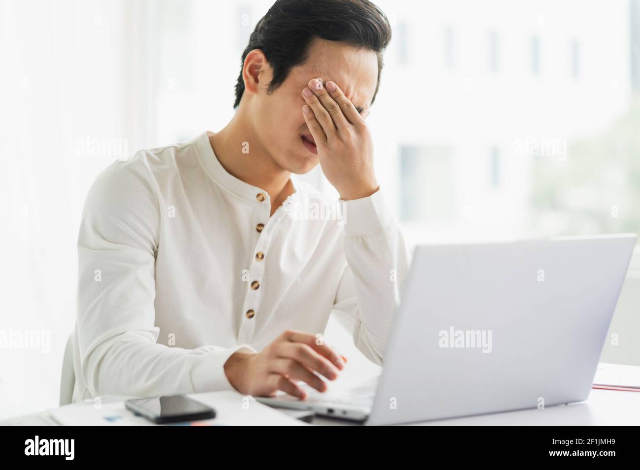 Male staff feel pressured and tired at work Stock Photo - Alamy