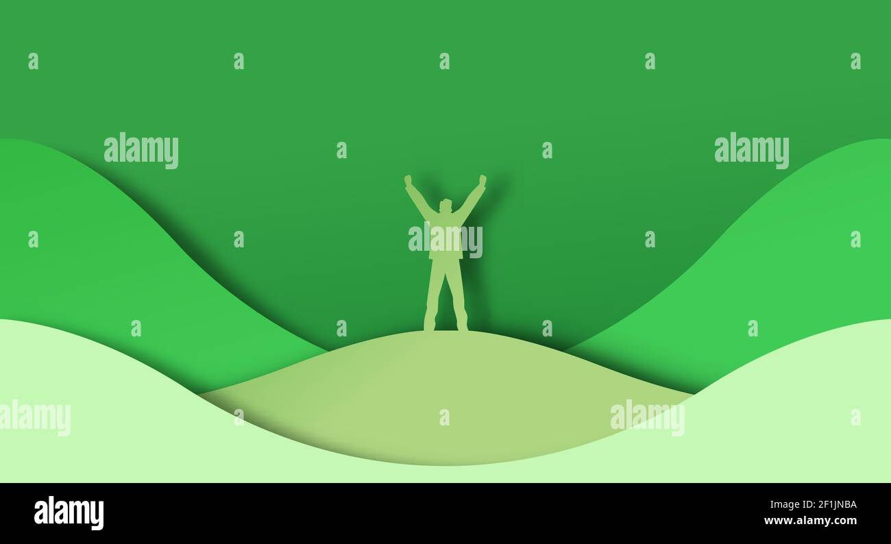 Happy business man with arms up in victory pose at top of mountain peak ...