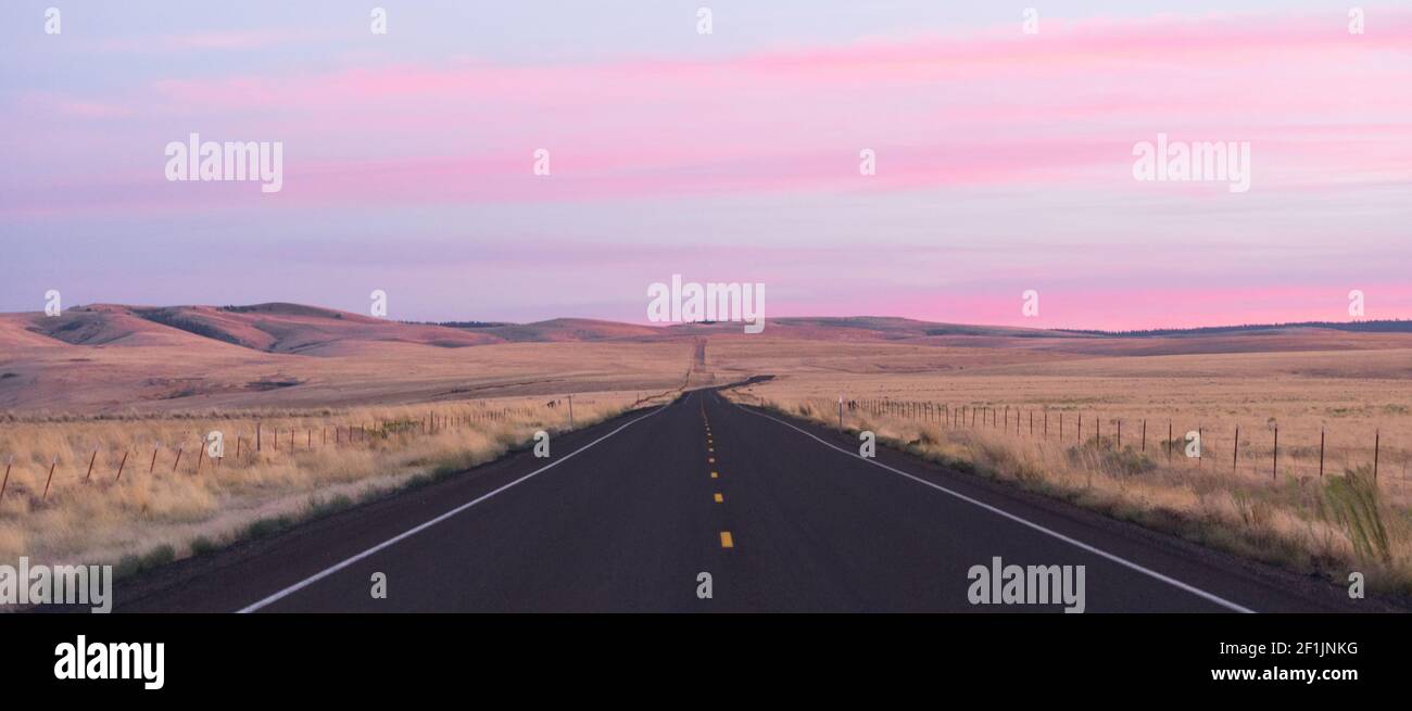 Dawn Breaks over Long Two Lane Road Blacktop Highway Stock Photo - Alamy
